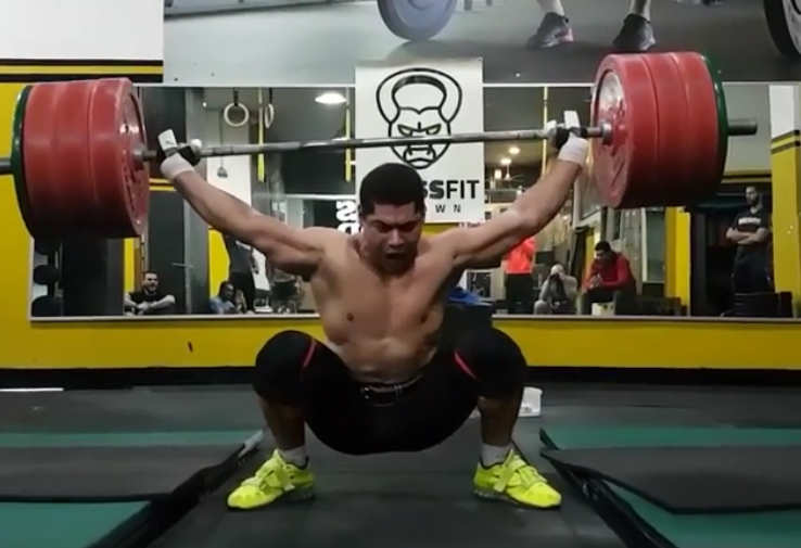 Watch These Two Weightlifters Fight Like Crazy to Save Their Lifts ...