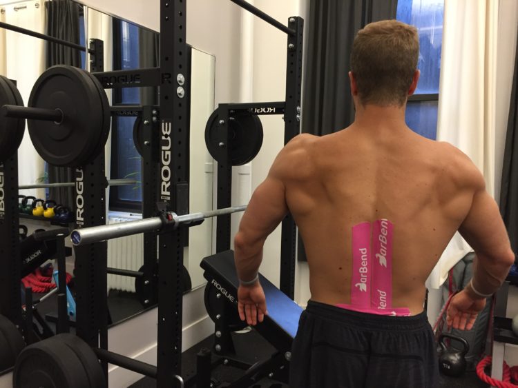 Kinesiology Taping for Lower Back Pain and Stability | BarBend