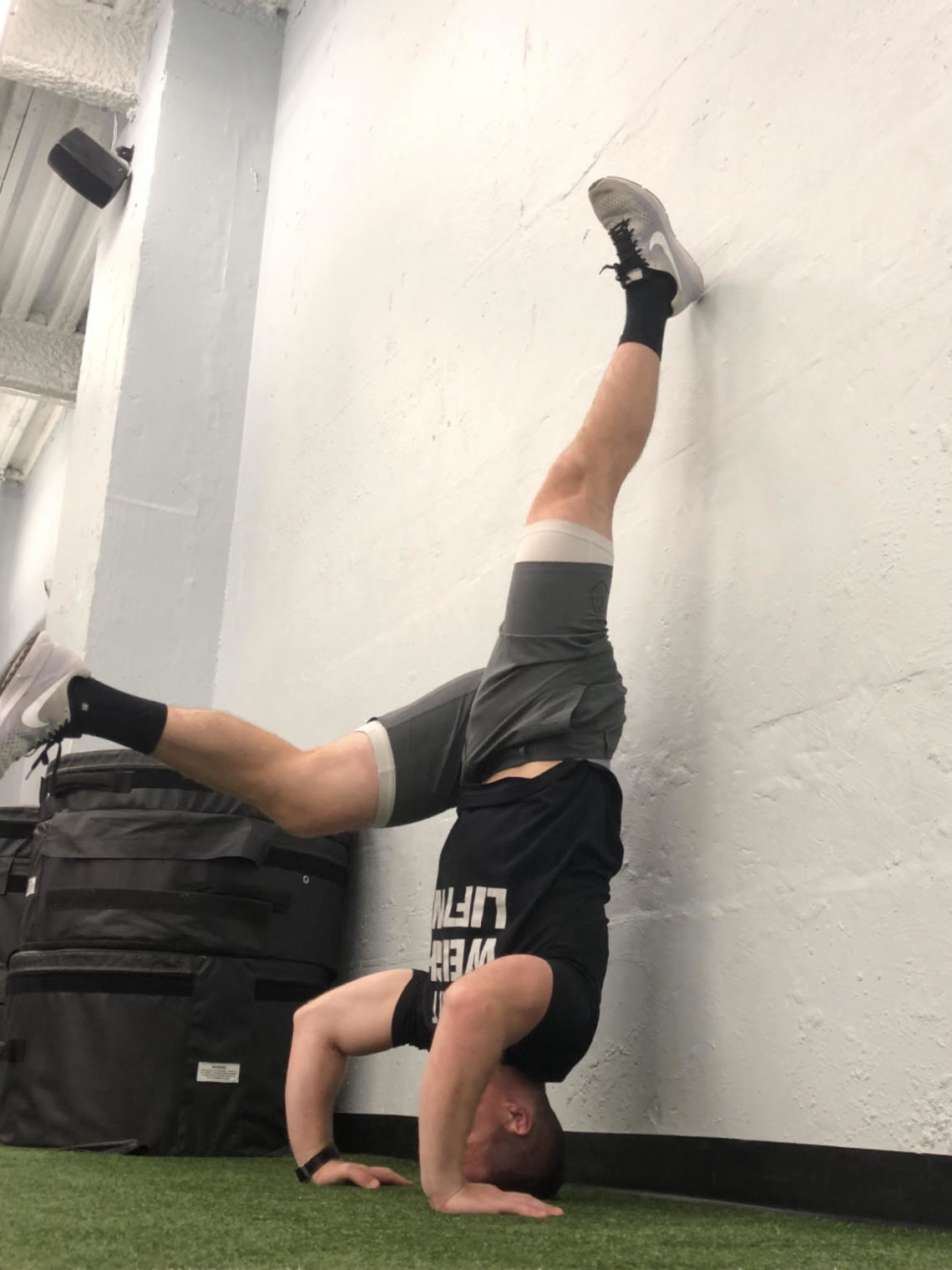 Handstand Push-Up (HSPU) Exercise Guide | BarBend