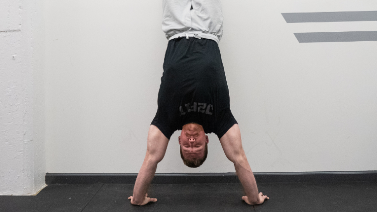 Turn Your Training On Its Head With the Handstand Push-Up | BarBend