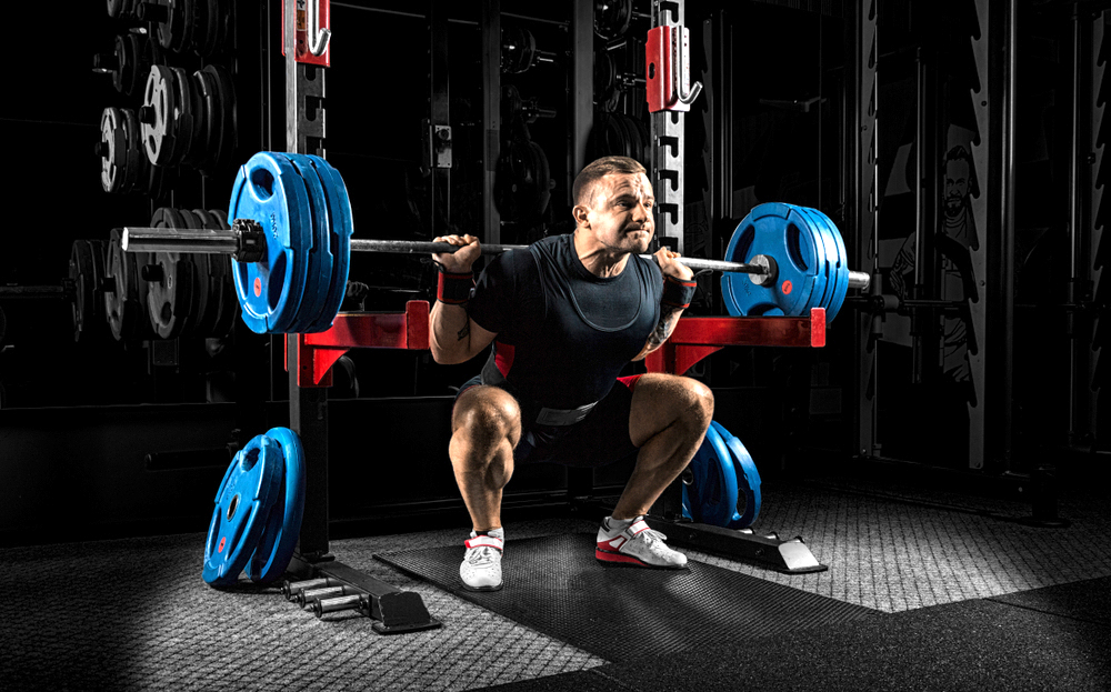 The Surprising History of 20-Rep Squats | BarBend