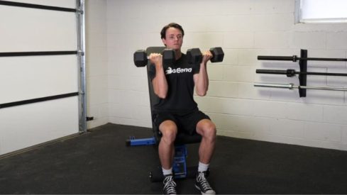 How to Do the Arnold Press: Proper Form & Variations | BarBend