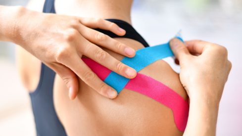 How Does Kinesiology Tape Work? + How to Use It Properly | BarBend