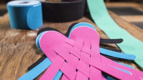 How Does Kinesiology Tape Work? + How to Use It Properly | BarBend